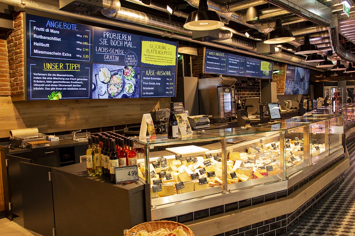 Außergewöhnliche Thekeninstallation in München | Wedeko Digital Signage