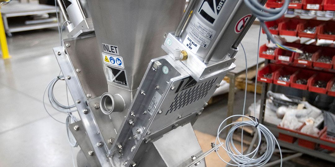 Gravity Vee Diverter Handling Oat Kernels | Vortex