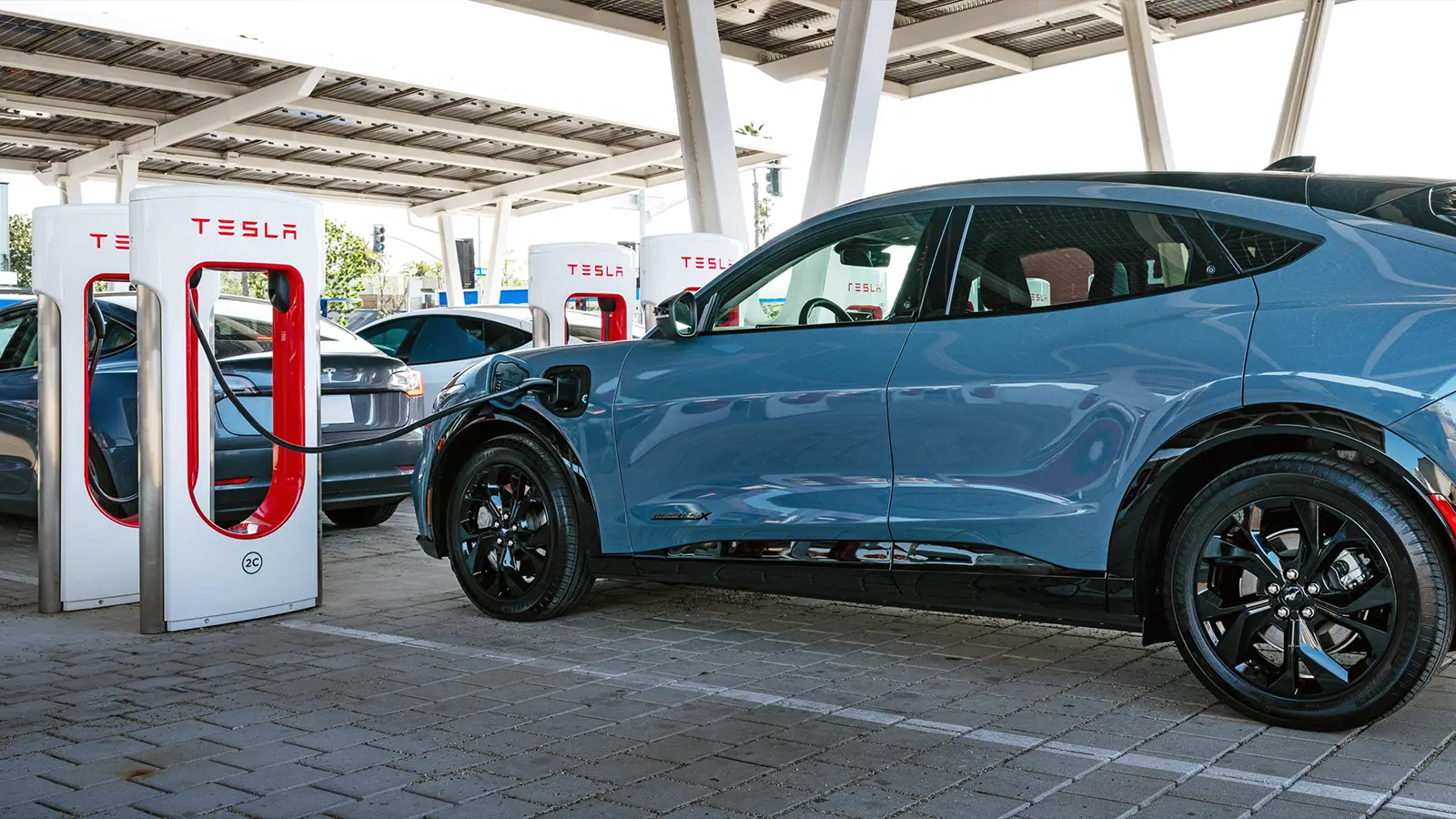 Ford EV Owners Can Now Use Tesla Superchargers with a Free Adapter ...