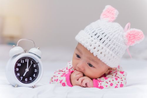 5fc878af0fc4f9517cad9b71_Cute-baby-infront-of-the-clock.jpeg