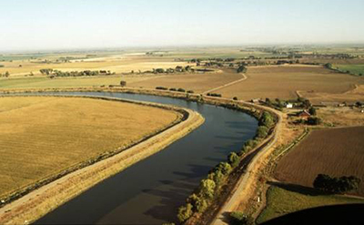Downstream flows: a basin-wide approach
