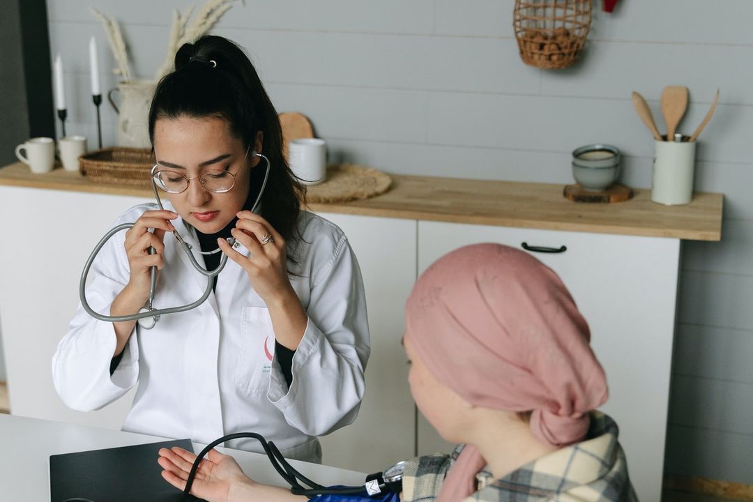 How to Become an Oncologist: Steps + Salary Information