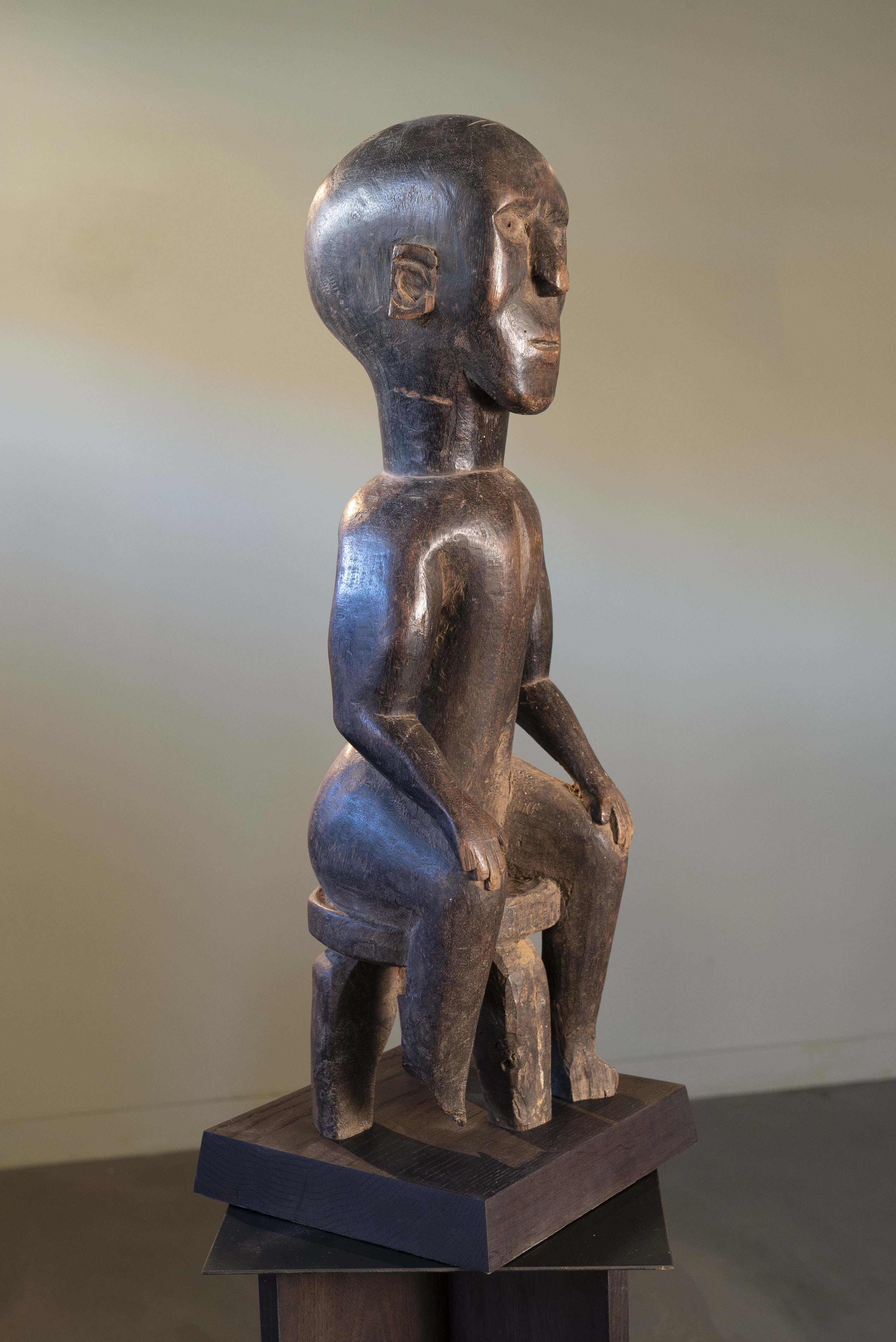 Large Kaguru Male Figure Depicted Sitting On Three-Legged Stool ...