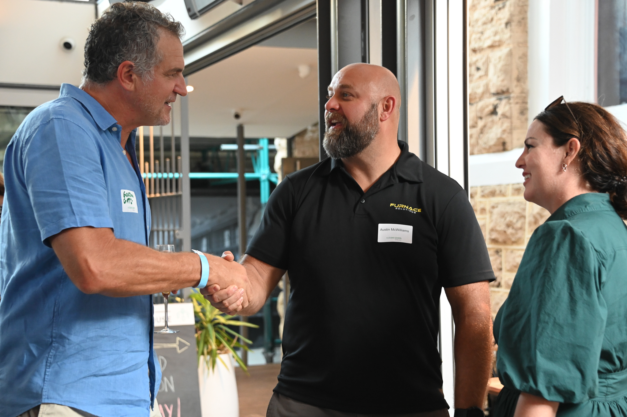 TSS Staff Member and Parent Shaking Hands