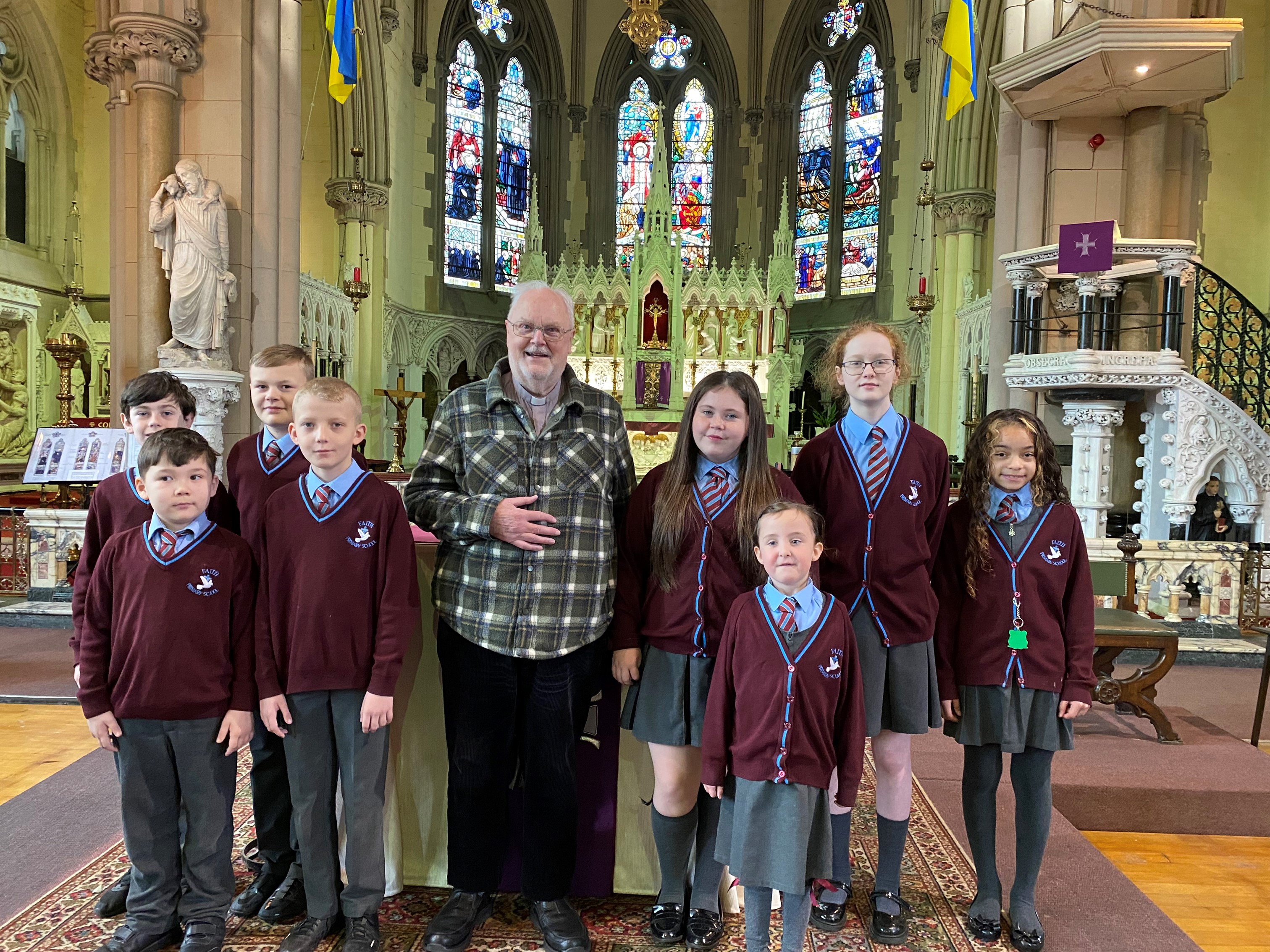 Staff and pupils at Faith Primary Academy bid parish priest a fond ...