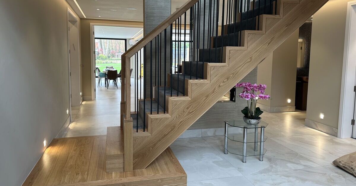 Solid Oak Cut Stringer Staircase With Round Black Iron Spindles and ...