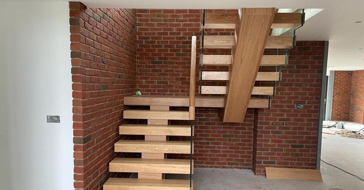 Solid Oak Spine Staircase With Sandwich Glass Balustrade | The Stair Shop