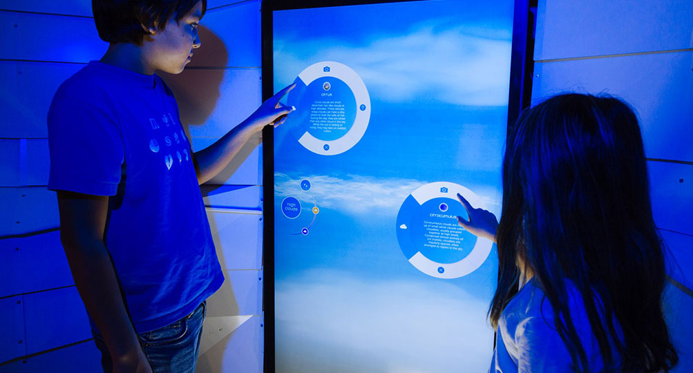 Museum Visitors Explore the Weather Lab