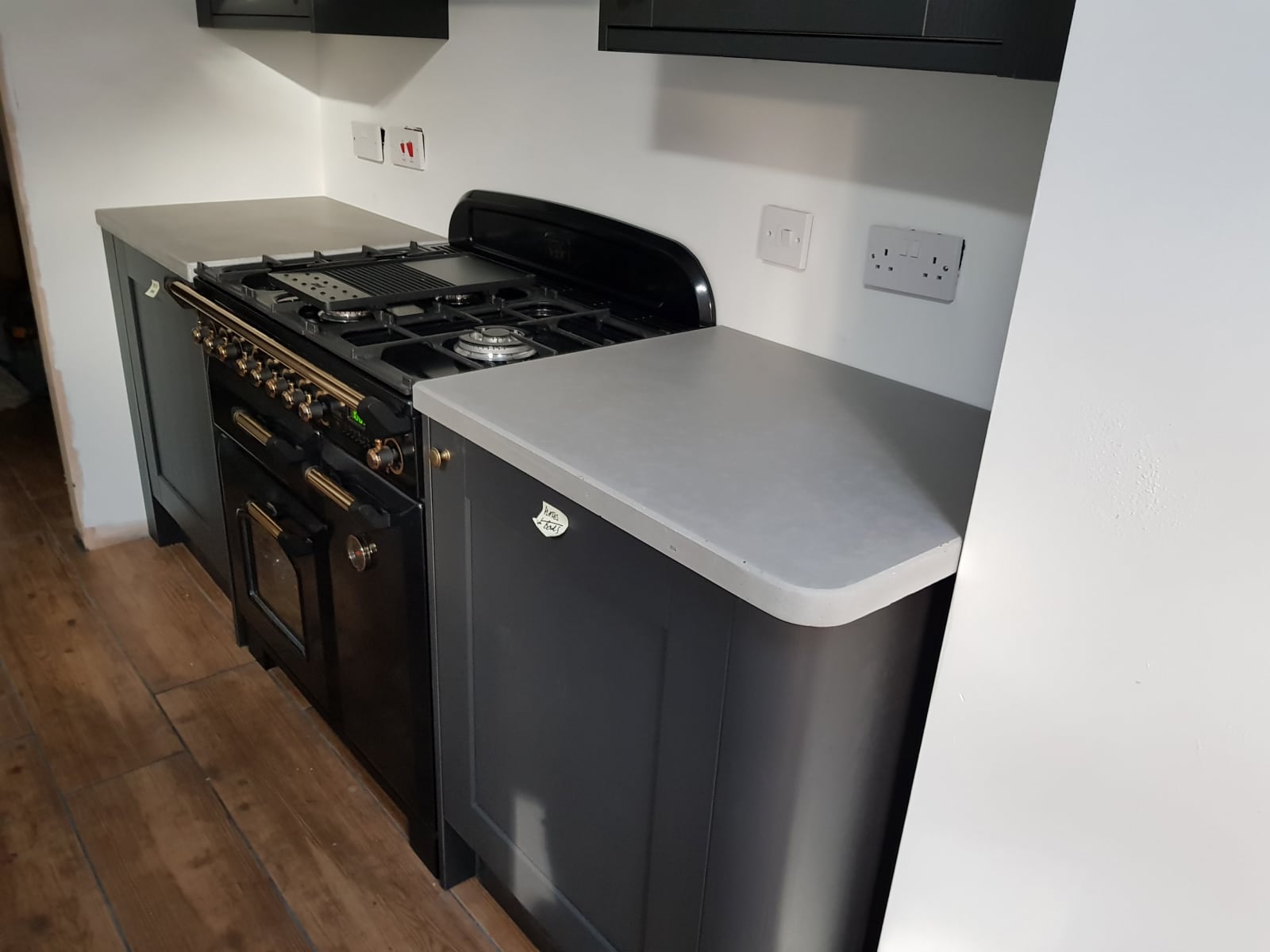 Light grey kitchen concrete worktop and island fitted in LondonLondon E10