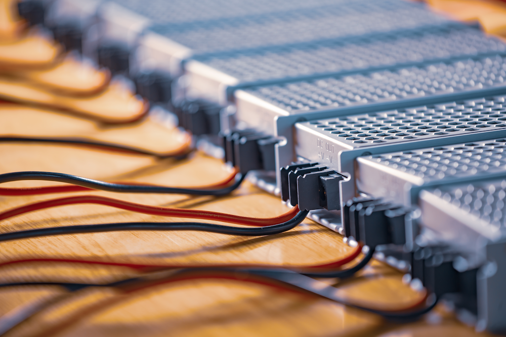 627aa68b8fc1e24231ca0696_metal-mesh-cases-of-power-supply-and-wires ...