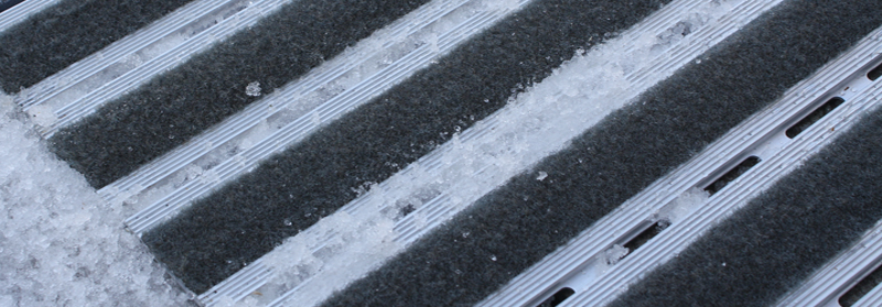 How do entrance mats perform in inclement weather?