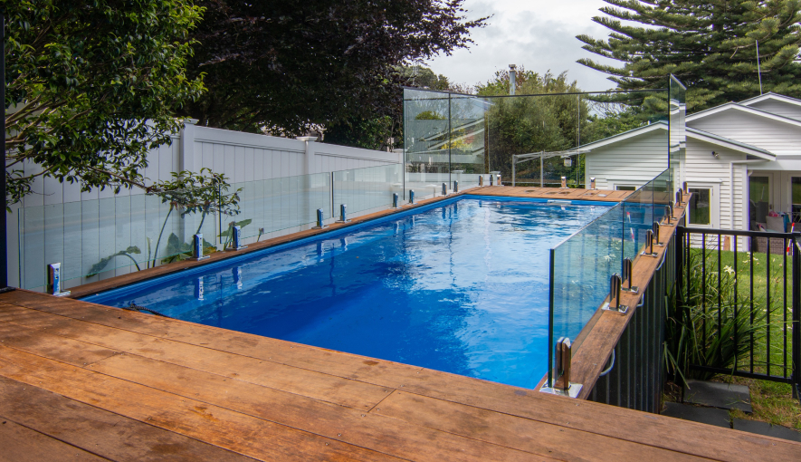 An elevated poolscape with a defined outdoor living area in Mount ...