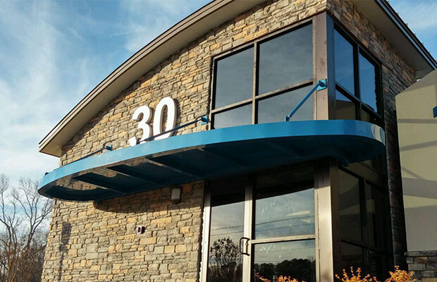 Curved Canopies | Custom Hanger-Supported Curved Aluminum Canopies