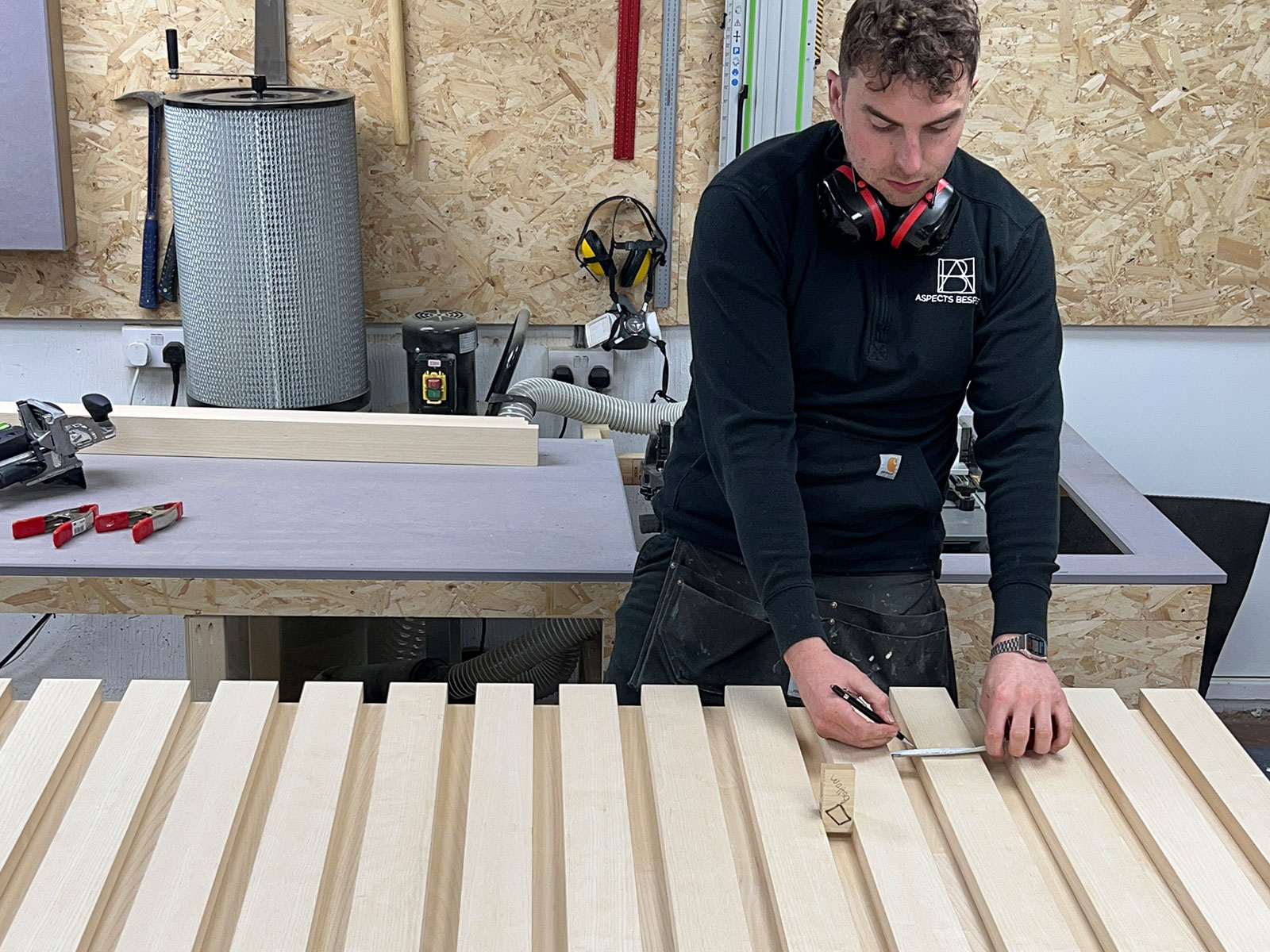 Button-fix | Insights | Invisibly fixing Aspects Bespoke's slatted TV wall