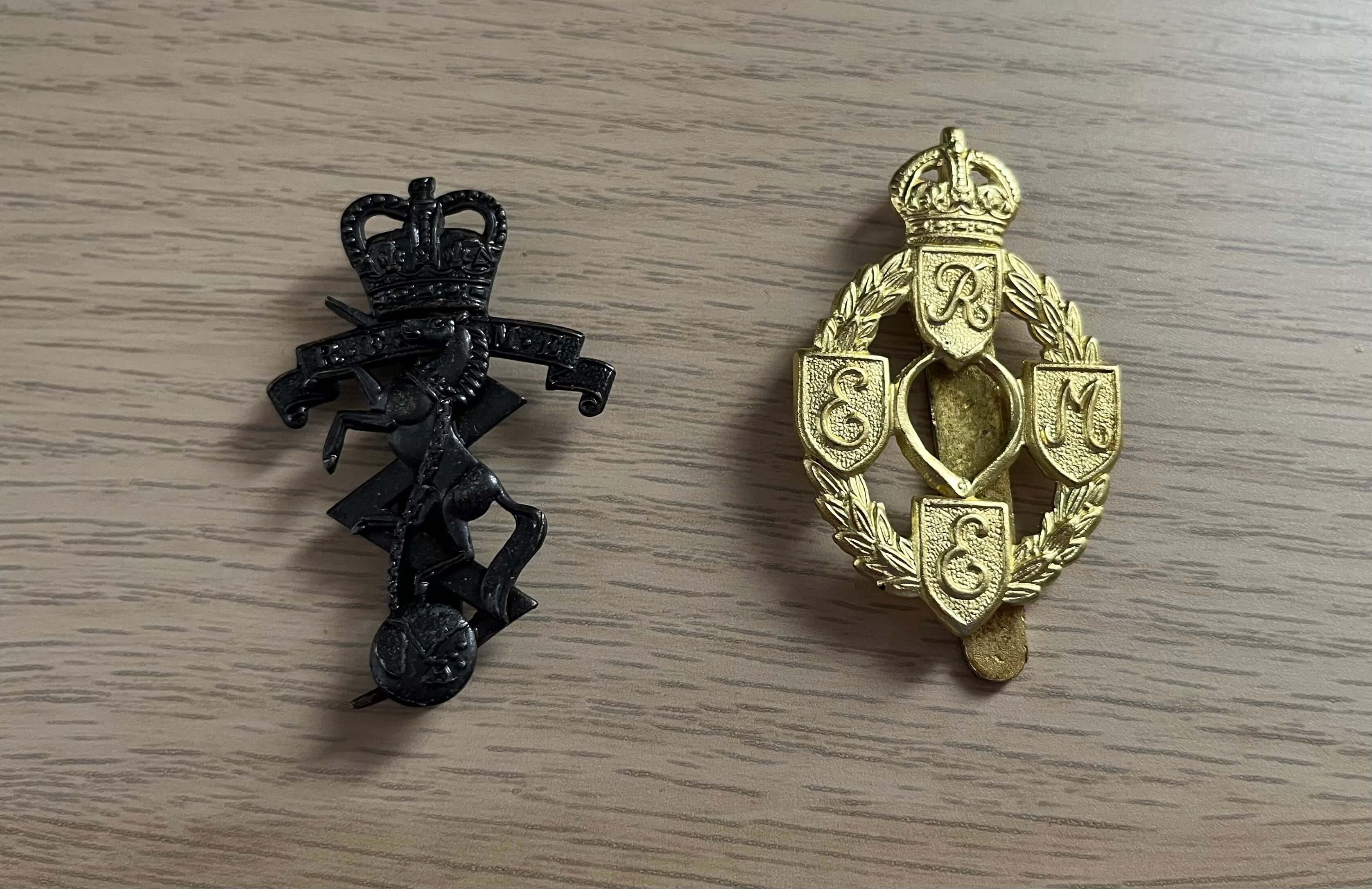 A Pair Of REME Cap Badges