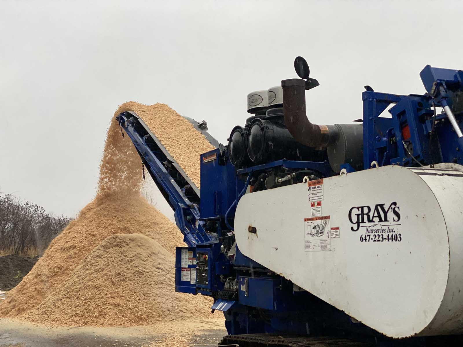 Professional Mulch Spreading with Blower Trucks | Gray's Landscaping