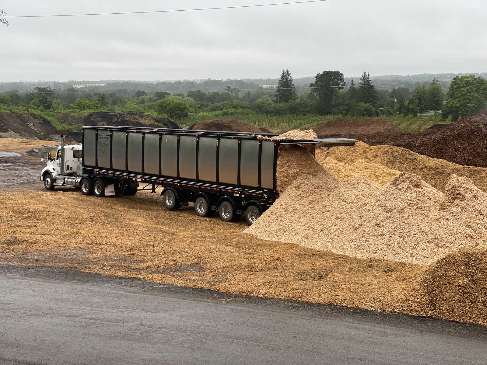 Professional Mulch Spreading with Blower Trucks | Gray's Landscaping