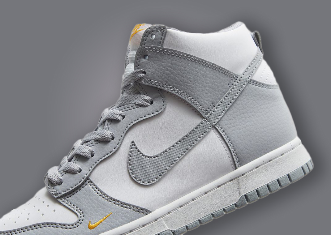 A Mini Swoosh Adorns This Nike Dunk High - Sneaker News