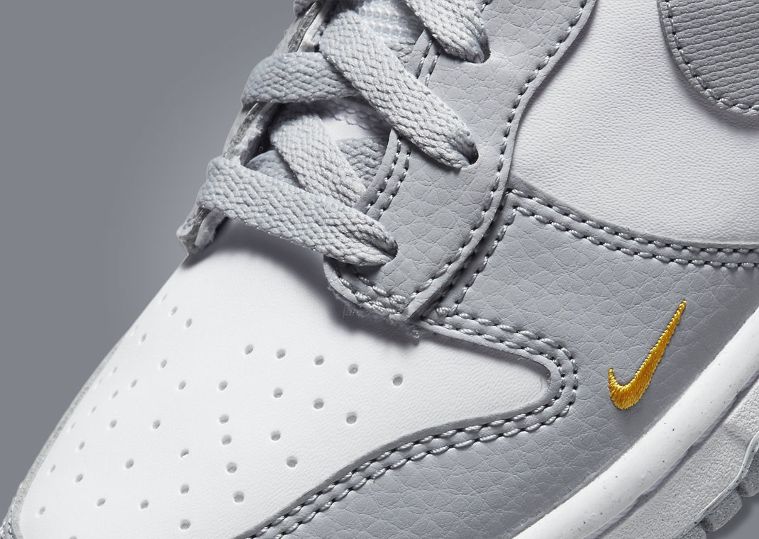 A Mini Swoosh Adorns This Nike Dunk High - Sneaker News