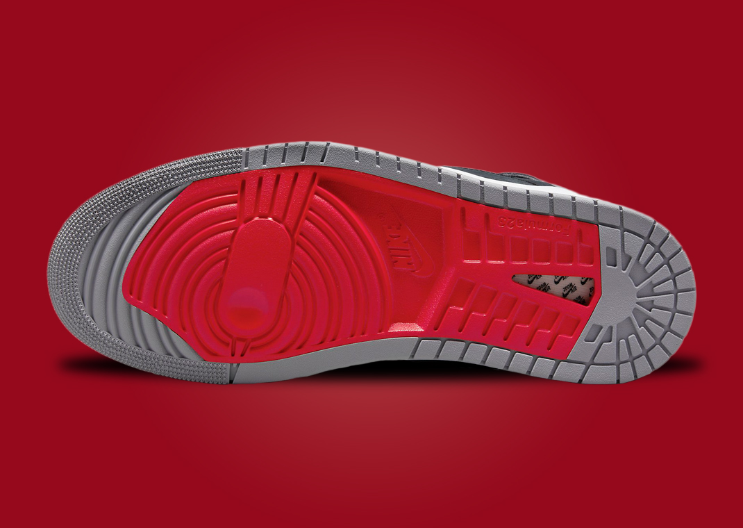 A Combo Of Black, Fire Red, And Cement Grey Cover This Air Jordan 1 ...